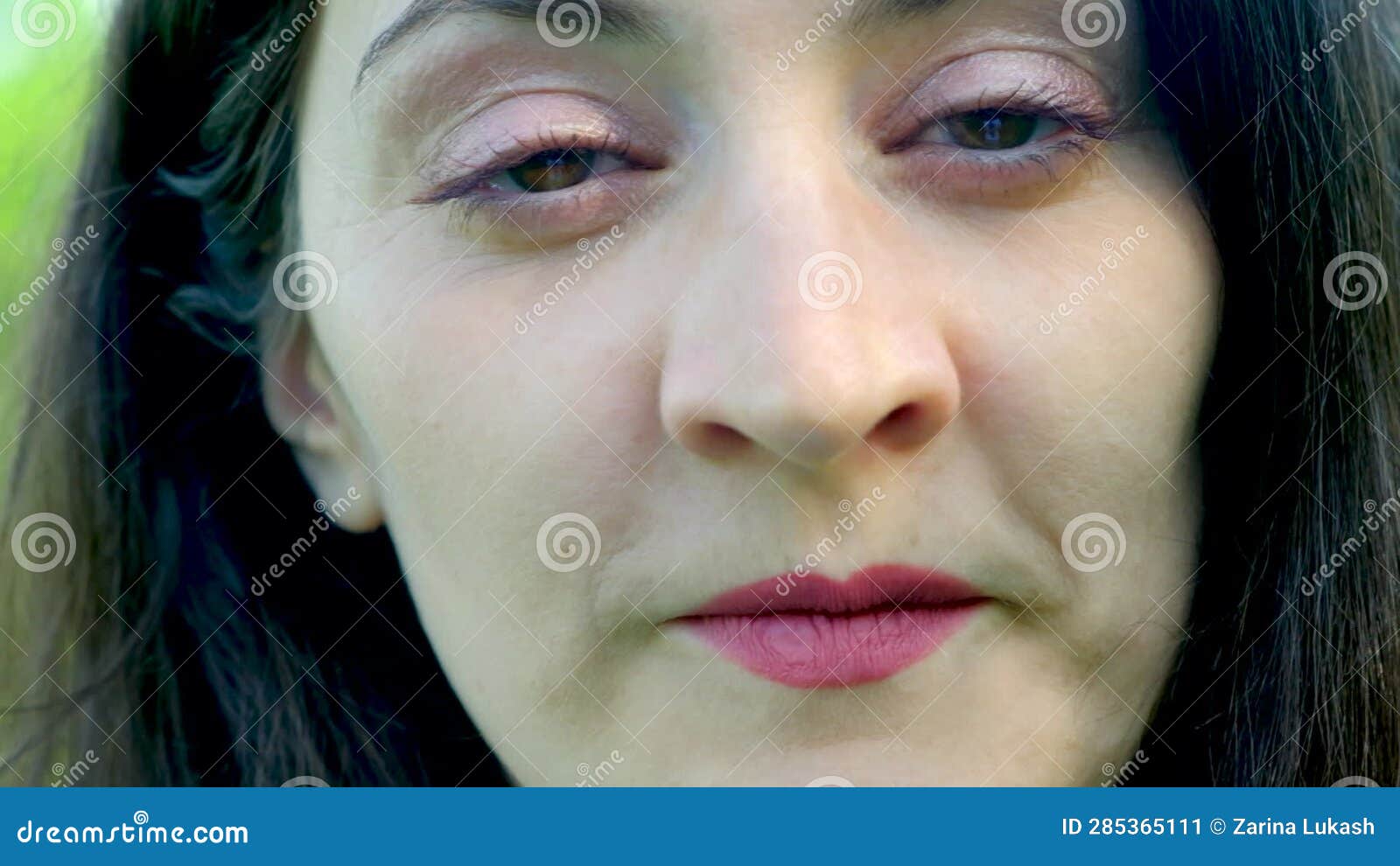 Funny Woman, Squinting and Clenching Her Teeth, Looks at the Camera ...