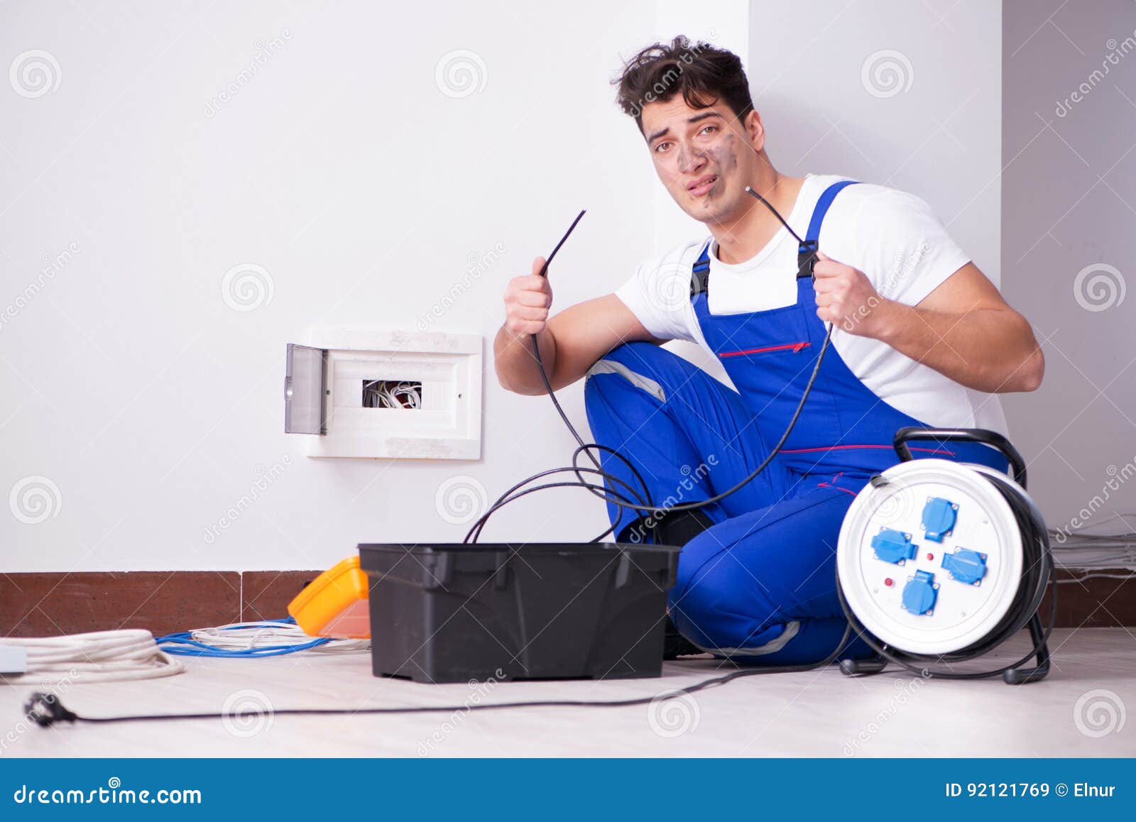 The Funny Young Electrician Working on Socket at Home Stock Image ...