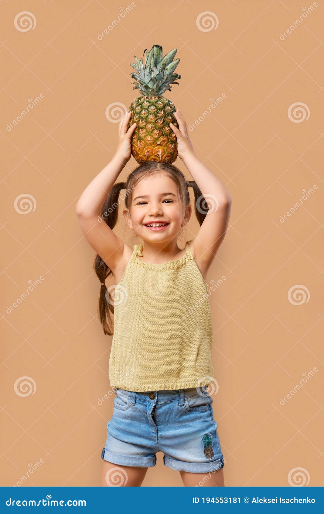 Funny Young Girl Playfully Posing with Pineapple on Beige Background ...
