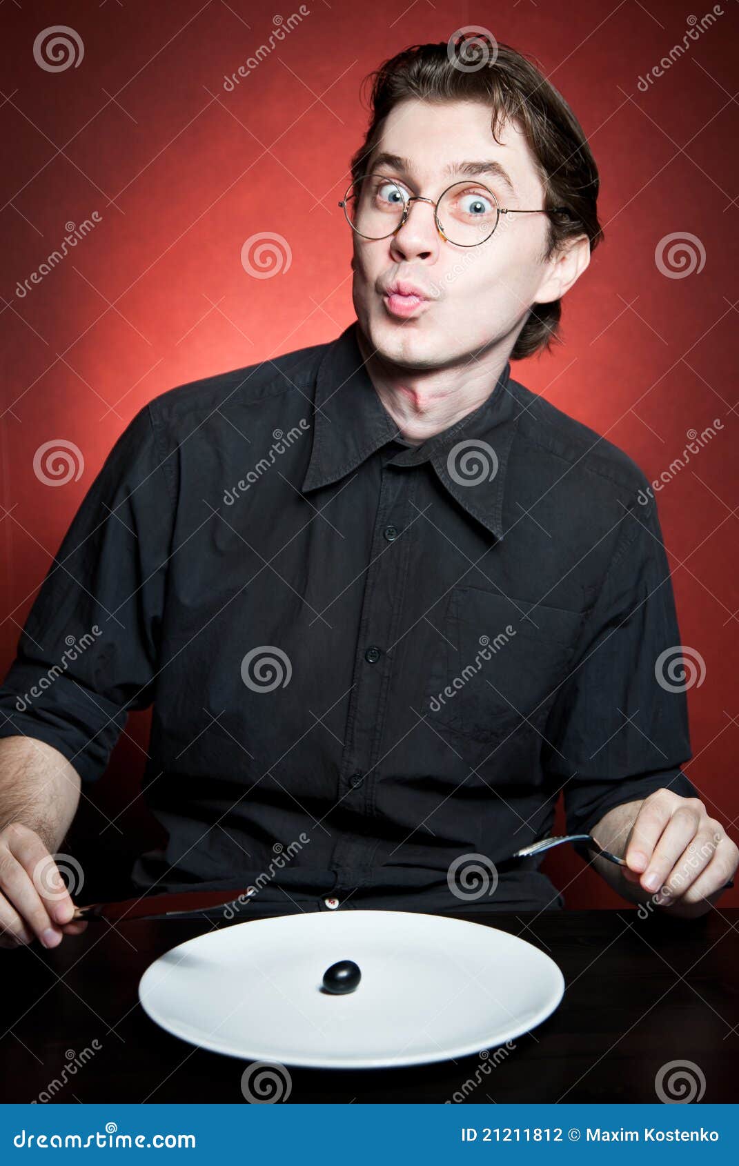 Funny young man eating stock photo. Image of strange - 21211812