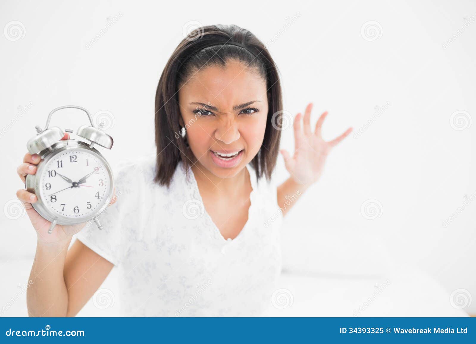 Furious Young Dark Haired Model Throwing an Alarm Clock Stock Image ...