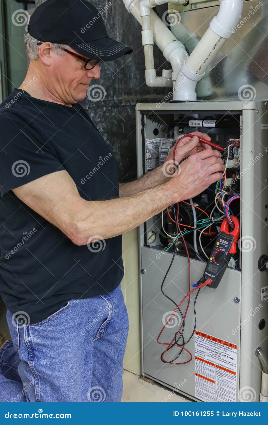 Furnace Repairman Servicing High Efficiency Heating Unit Stock Image ...