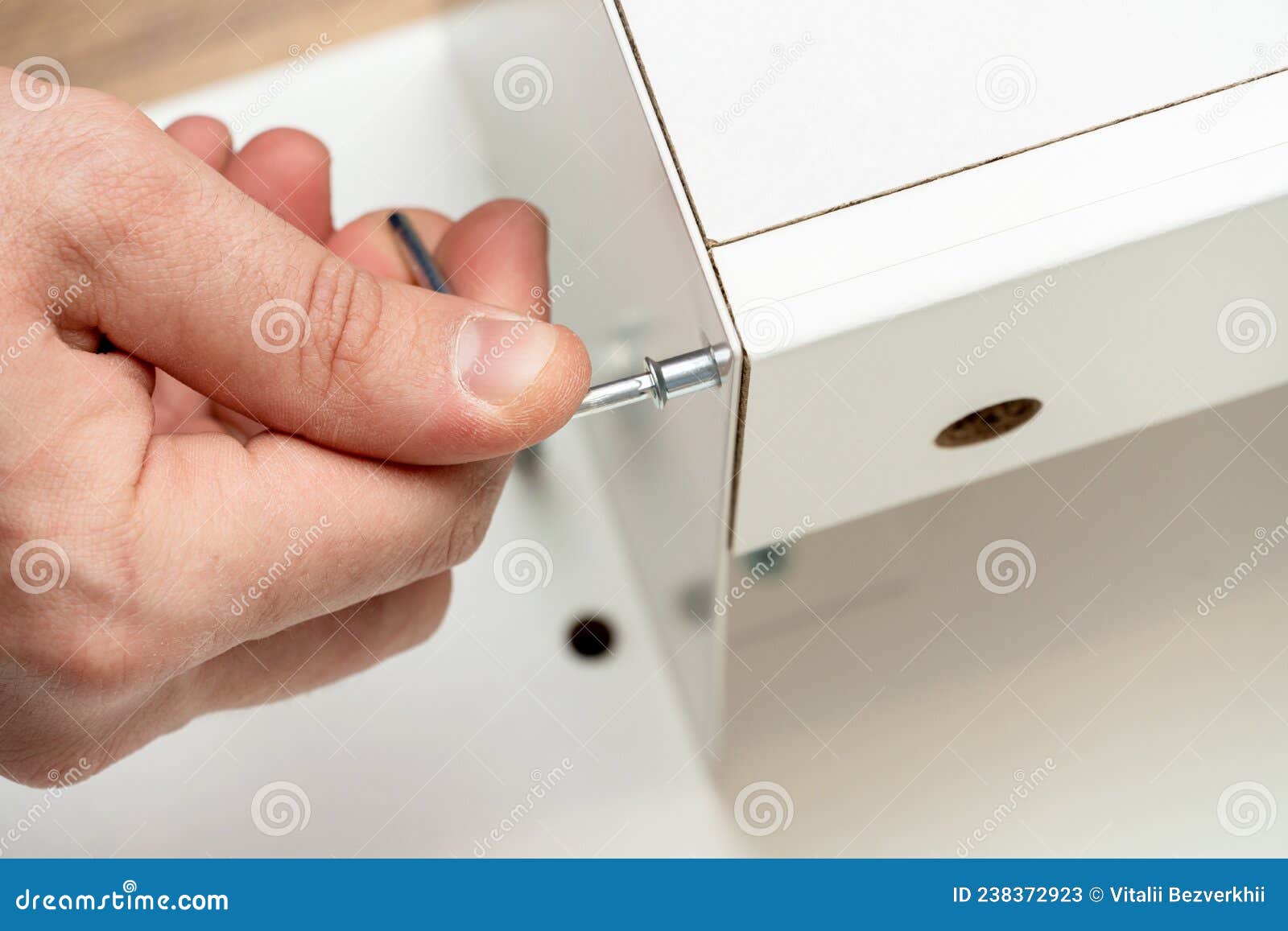 Furniture Assembling Screwing Tightening The Hexagon Bolt With A