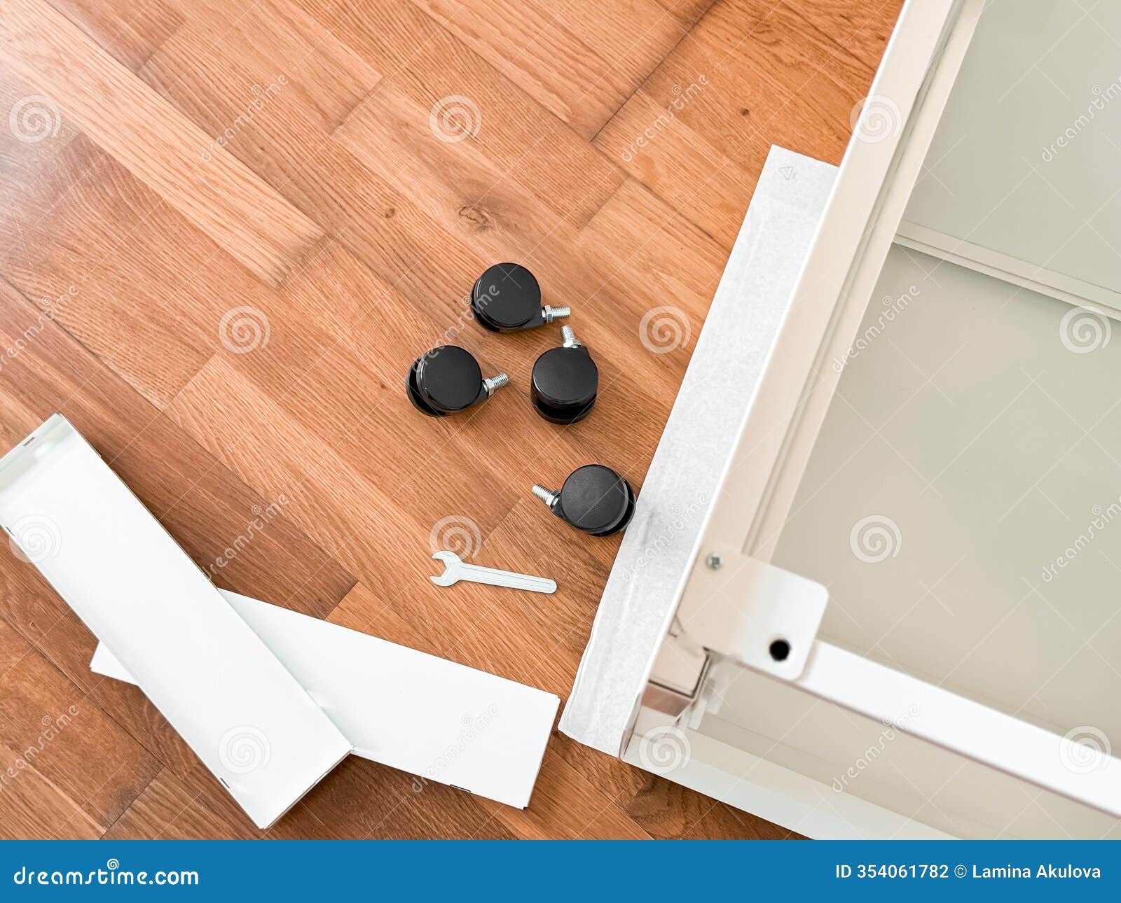 Furniture Assembly with Wheels on Hardwood Floor Stock Photo - Image of ...