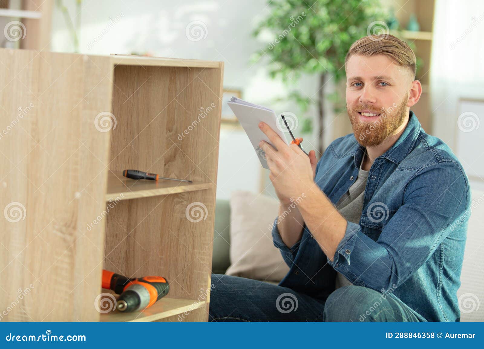 Furniture Assembly Worker Assembles Bookshelf Stock Photo - Image of ...