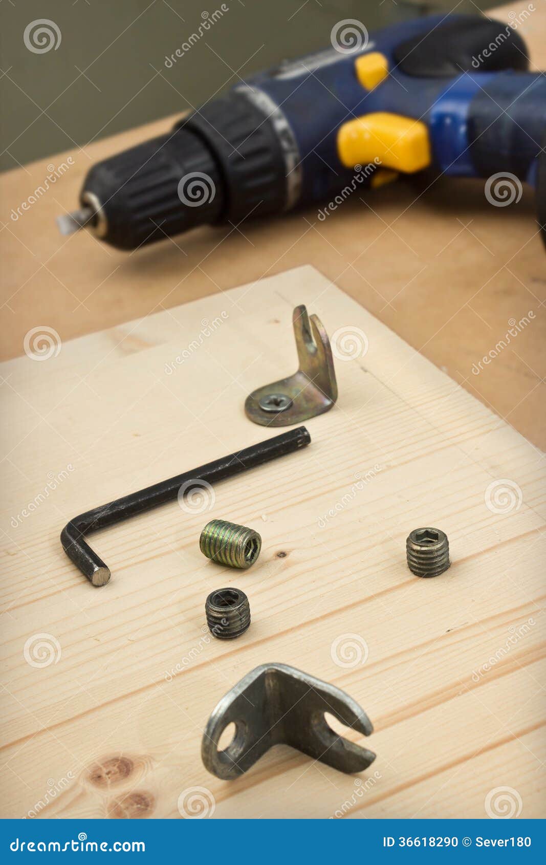 Furniture Parts and Electric Screwdriver on the Table Stock Photo ...