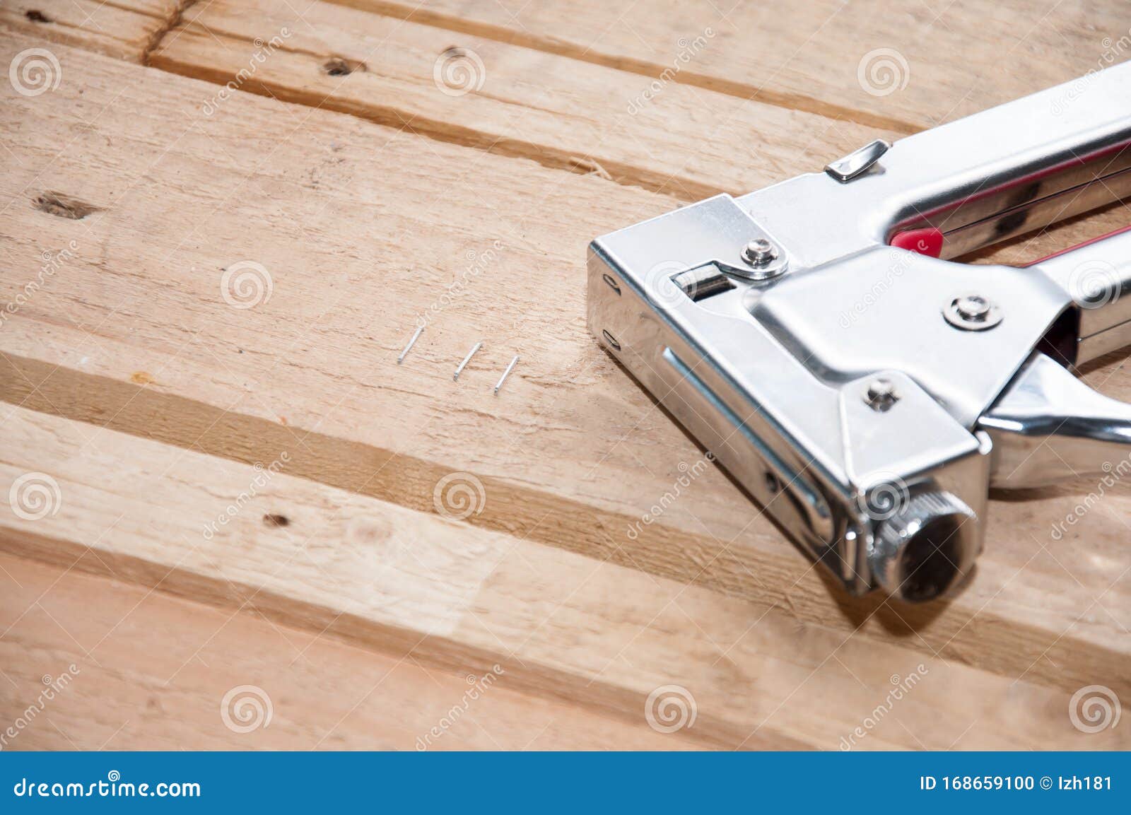 Furniture Stapler Closeup on Wooden Background. Furniture Maker Tool ...