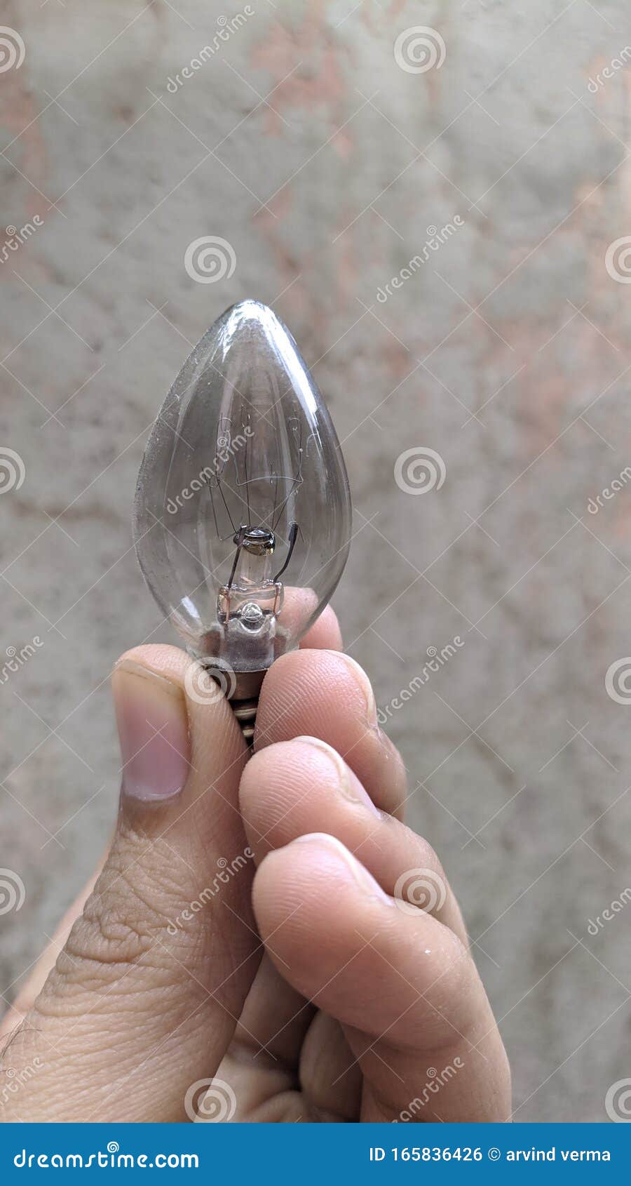 Small Sharp Glass Light Bulb in the Hand Stock Photo - Image of ...