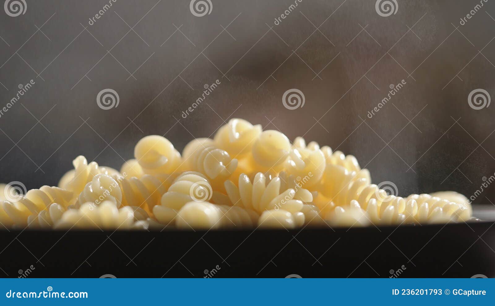 Fusilli on Black Plate with Steam Rising Stock Image - Image of kitchen ...