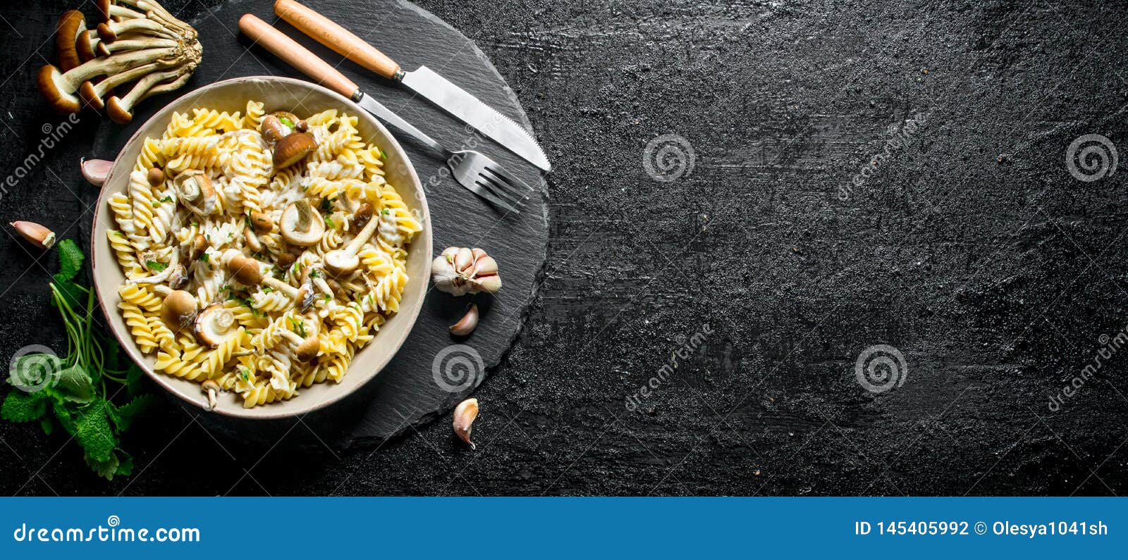 Fusilli Paste in Plate with Mushrooms, Garlic and Mint Leaves Stock ...