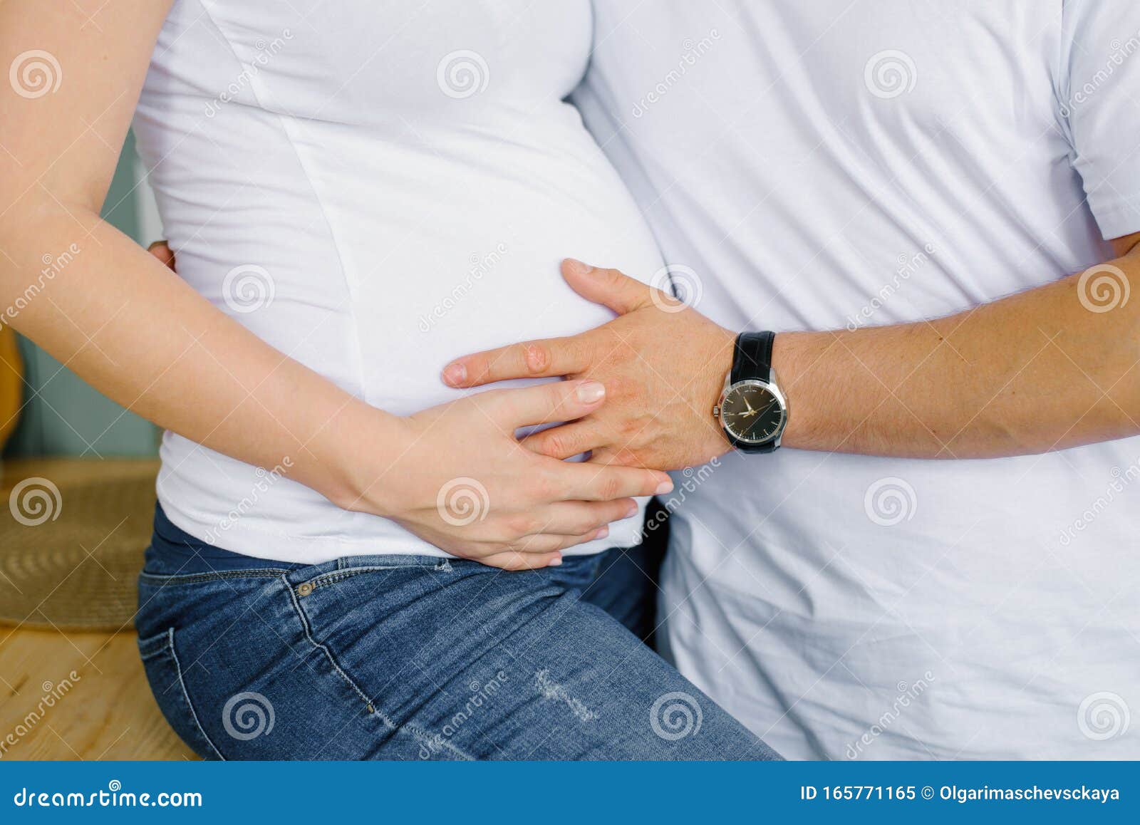 The Future Father Holds His Hand On The Stomach Of The Future Mother