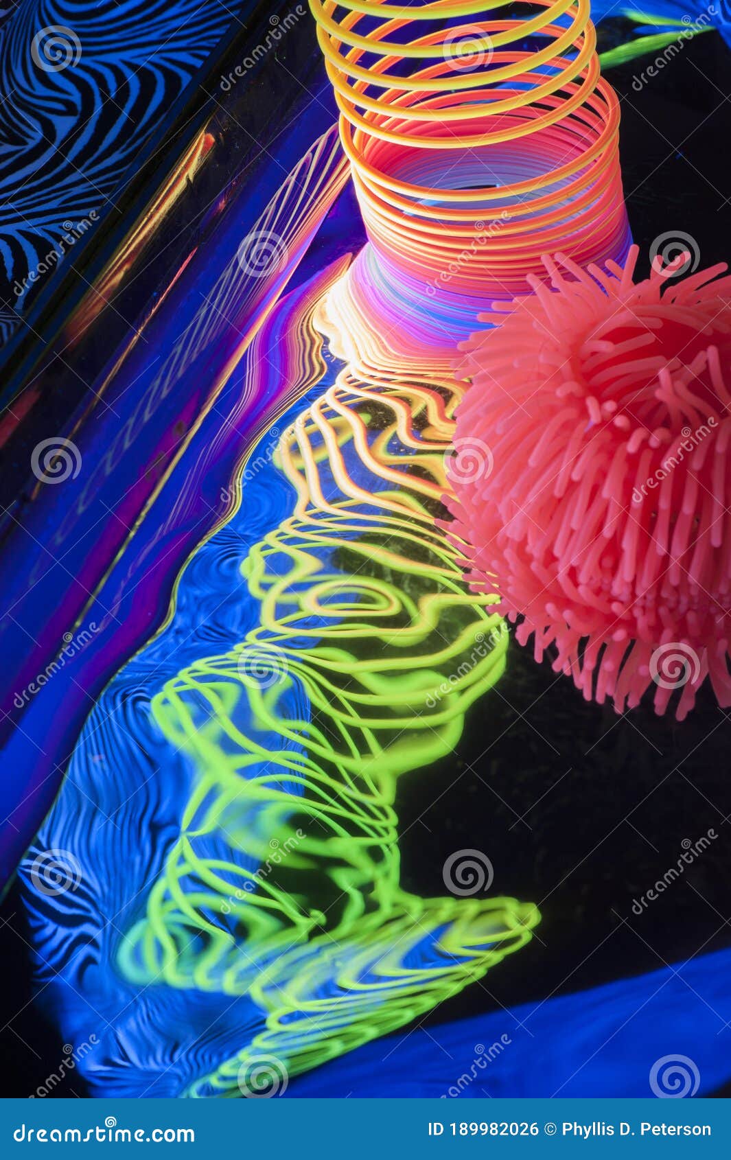 Fuzzy and Circular Objects are Lit with Fluorescent Colors Against a ...