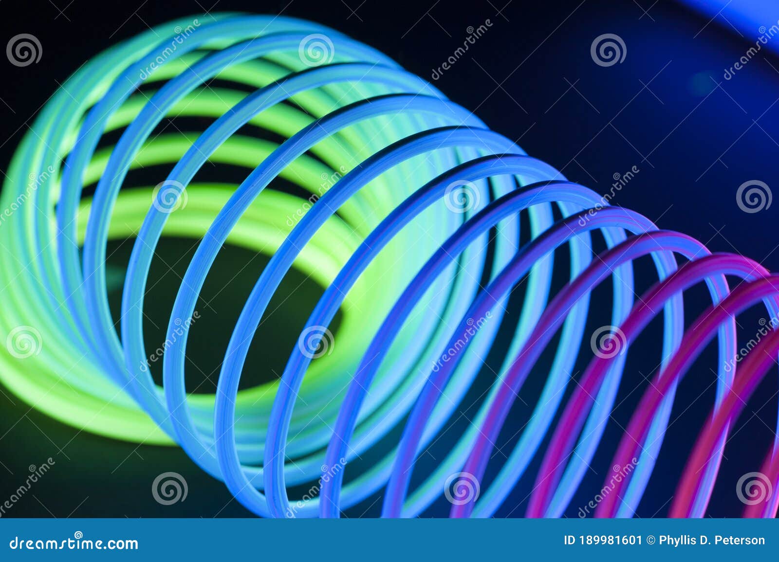 Fuzzy and Circular Objects are Lit with Fluorescent Colors Against a ...