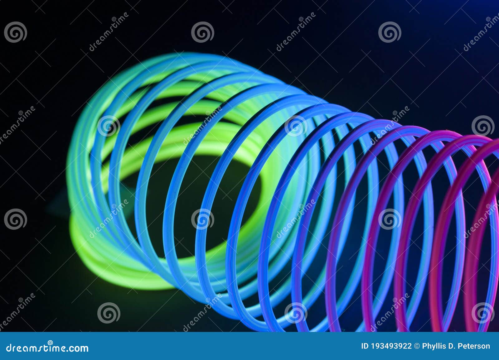 Fuzzy and Circular Objects are Lit with Fluorescent Colors Against a ...