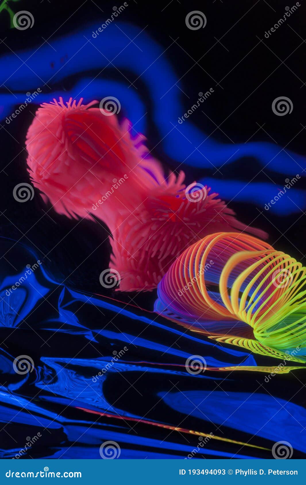 Fuzzy and Circular Objects are Lit with Fluorescent Colors Against a ...