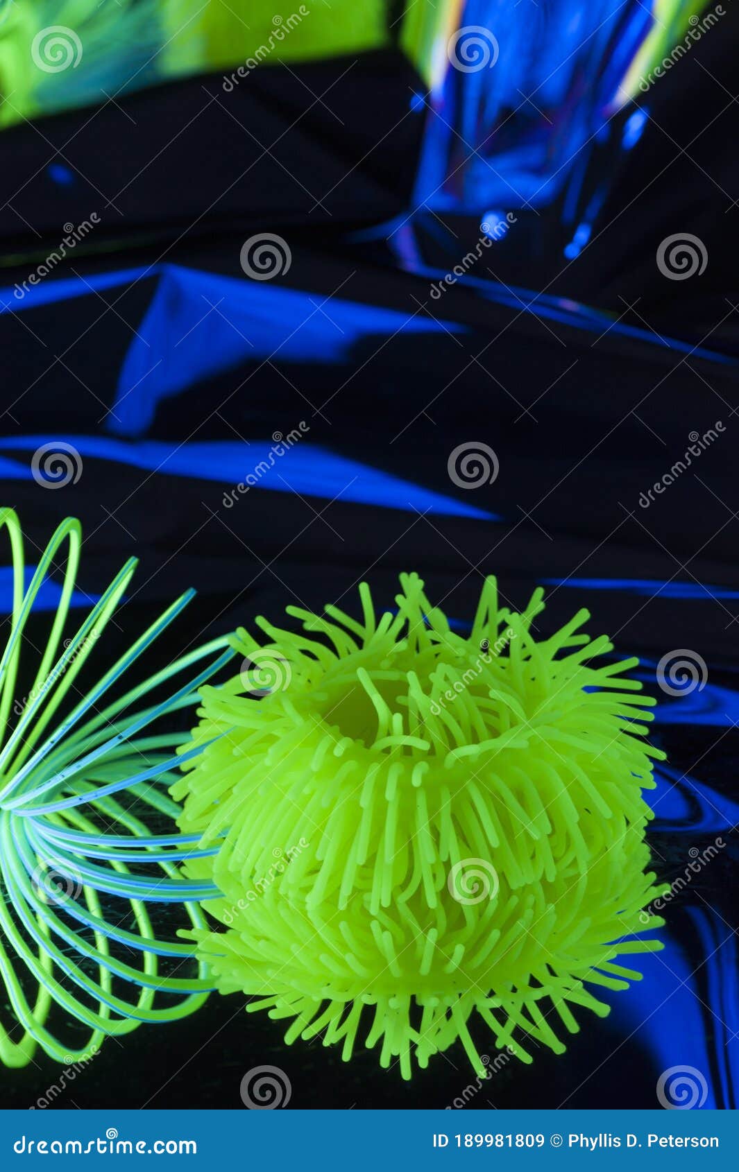 Fuzzy Objects in Close-up View are Lit with Fluorescent Colors Against ...