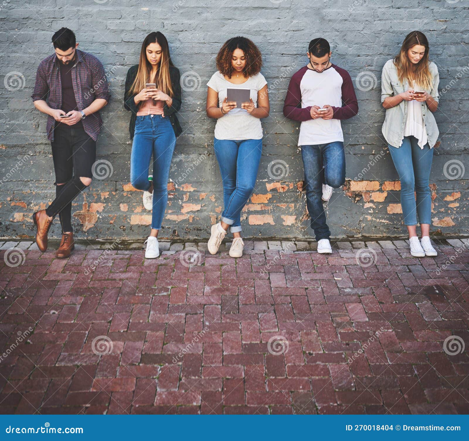 The 4g Generation. a Group of Young People Using Their Wireless Devices ...