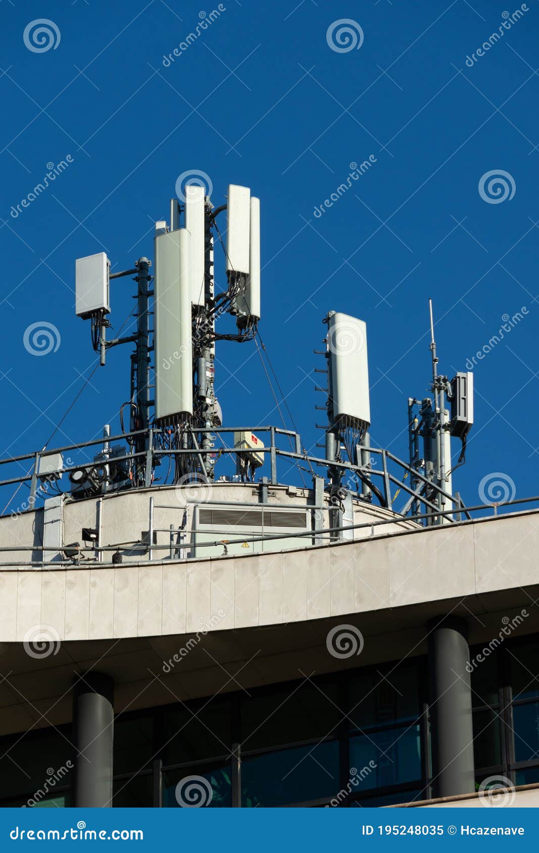 5G and 4G Mobile Phone Antennas Installed on the Rooftop of a Building ...