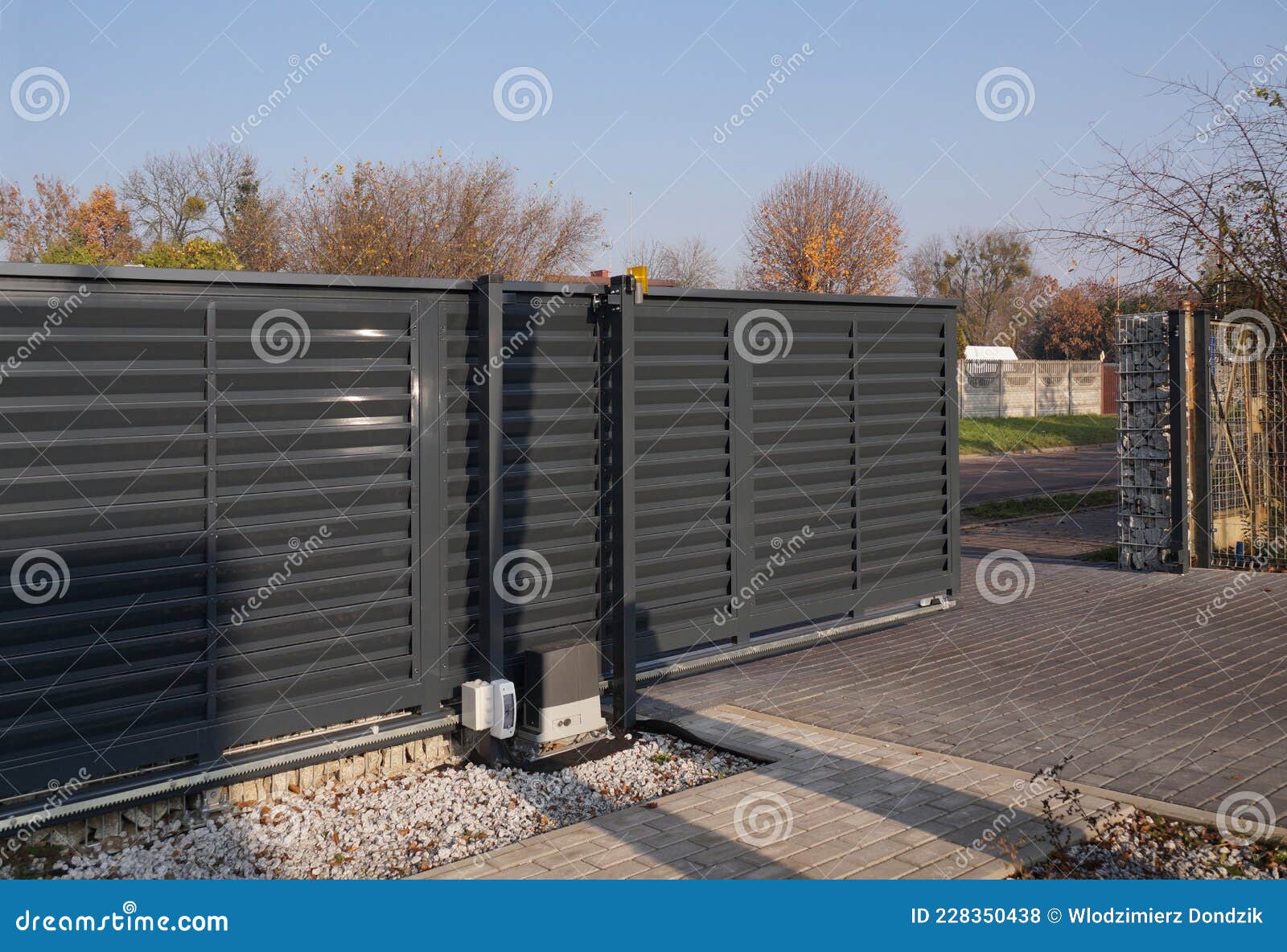 Gabion. Automatic Entrance Gate Used in Combination with a Wall Made of ...