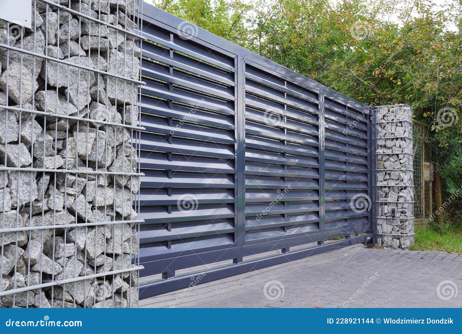 Gabion. Automatic Entrance Gate Used in Combination with a Wall Made of ...