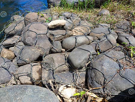A Gabion at River Side. Box Filled with Rocks Stock Photo - Image of ...
