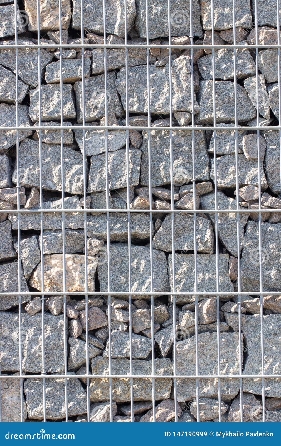 Gabion, A Stone Wall With A Metal Grid Of Gray Granite Texture Stock ...