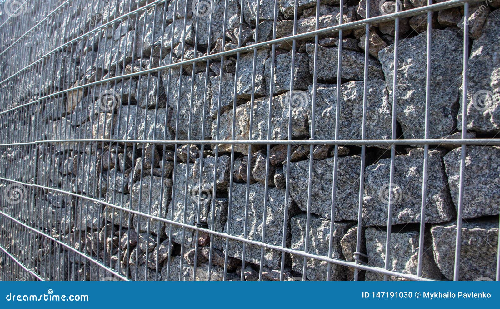 Gabion, a Stone Wall with a Metal Grid of Gray Granite Texture Stock ...
