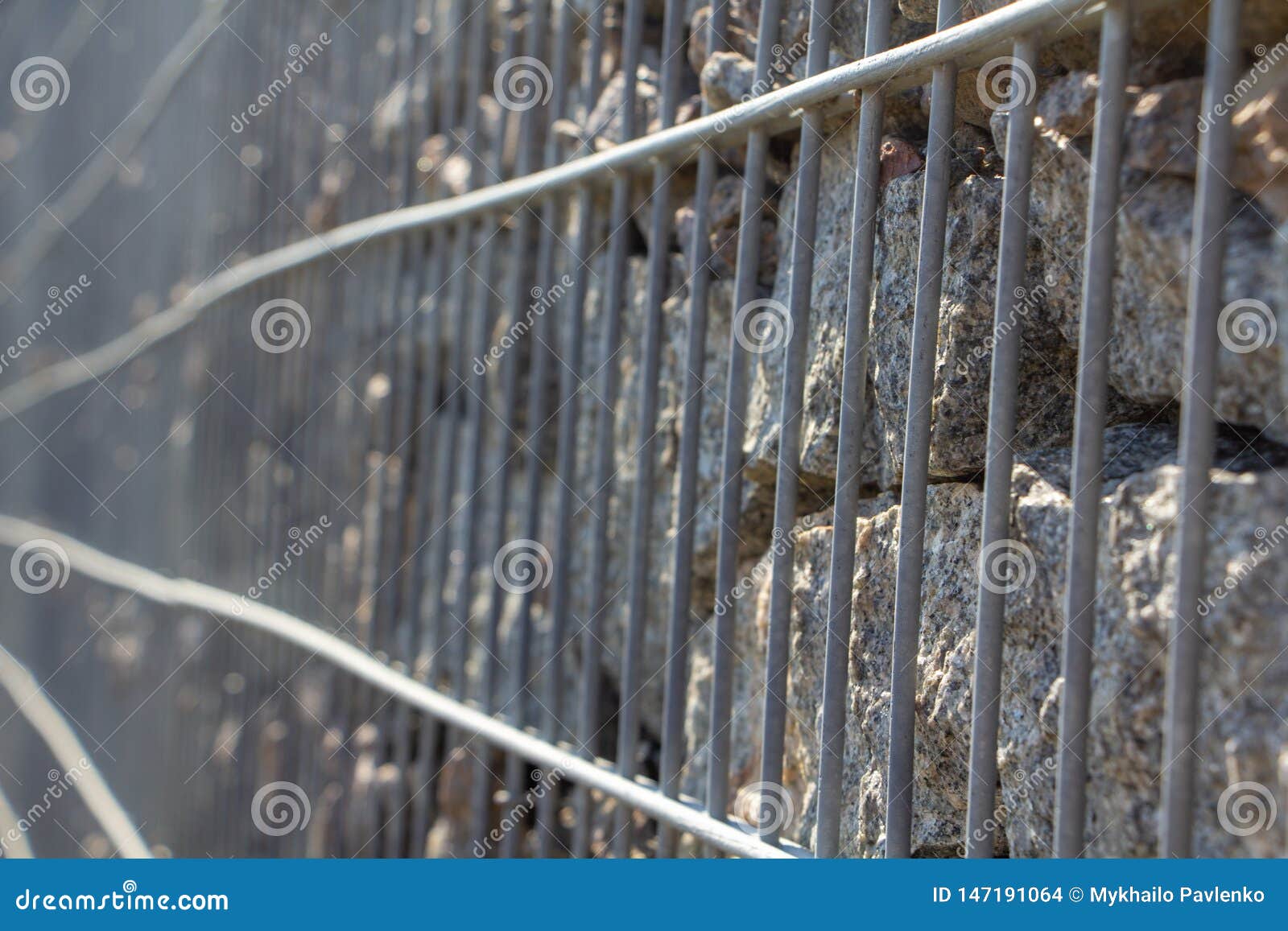 Gabion, a Stone Wall with a Metal Grid of Gray Granite Texture Stock ...
