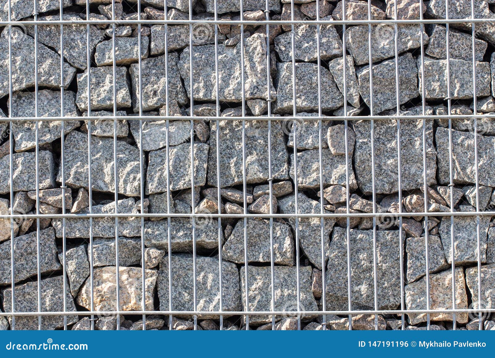 Gabion, a Stone Wall with a Metal Grid of Gray Granite Texture Stock ...