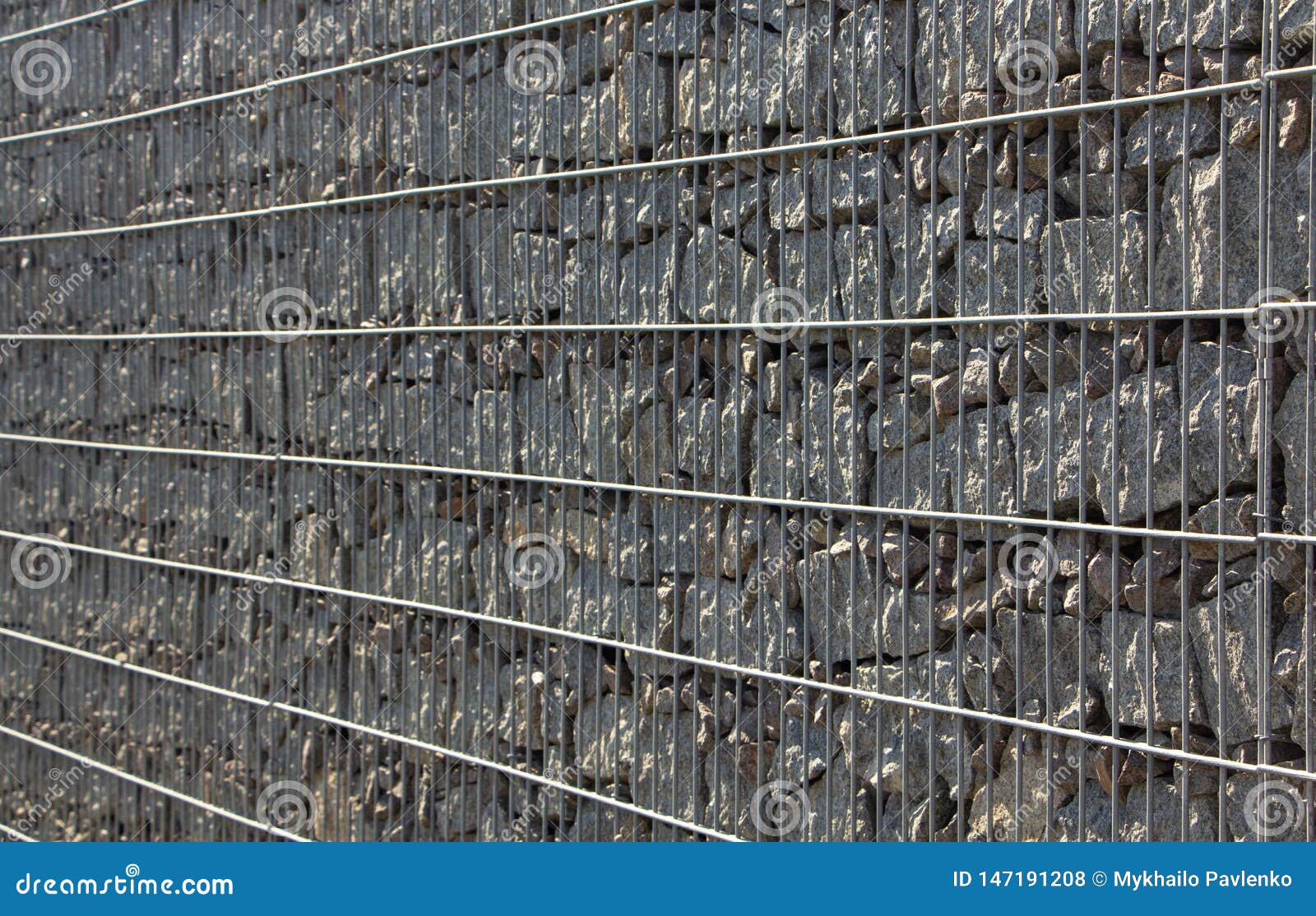 Gabion, a Stone Wall with a Metal Grid of Gray Granite Texture Stock ...