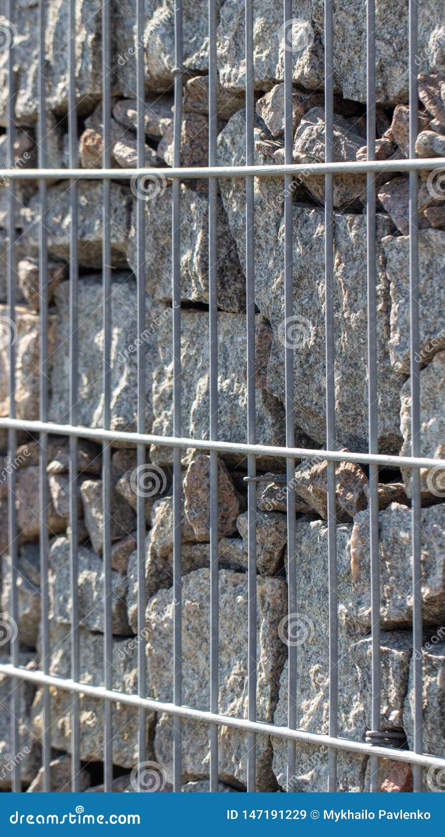 Gabion, a Stone Wall with a Metal Grid of Gray Granite Texture Stock ...