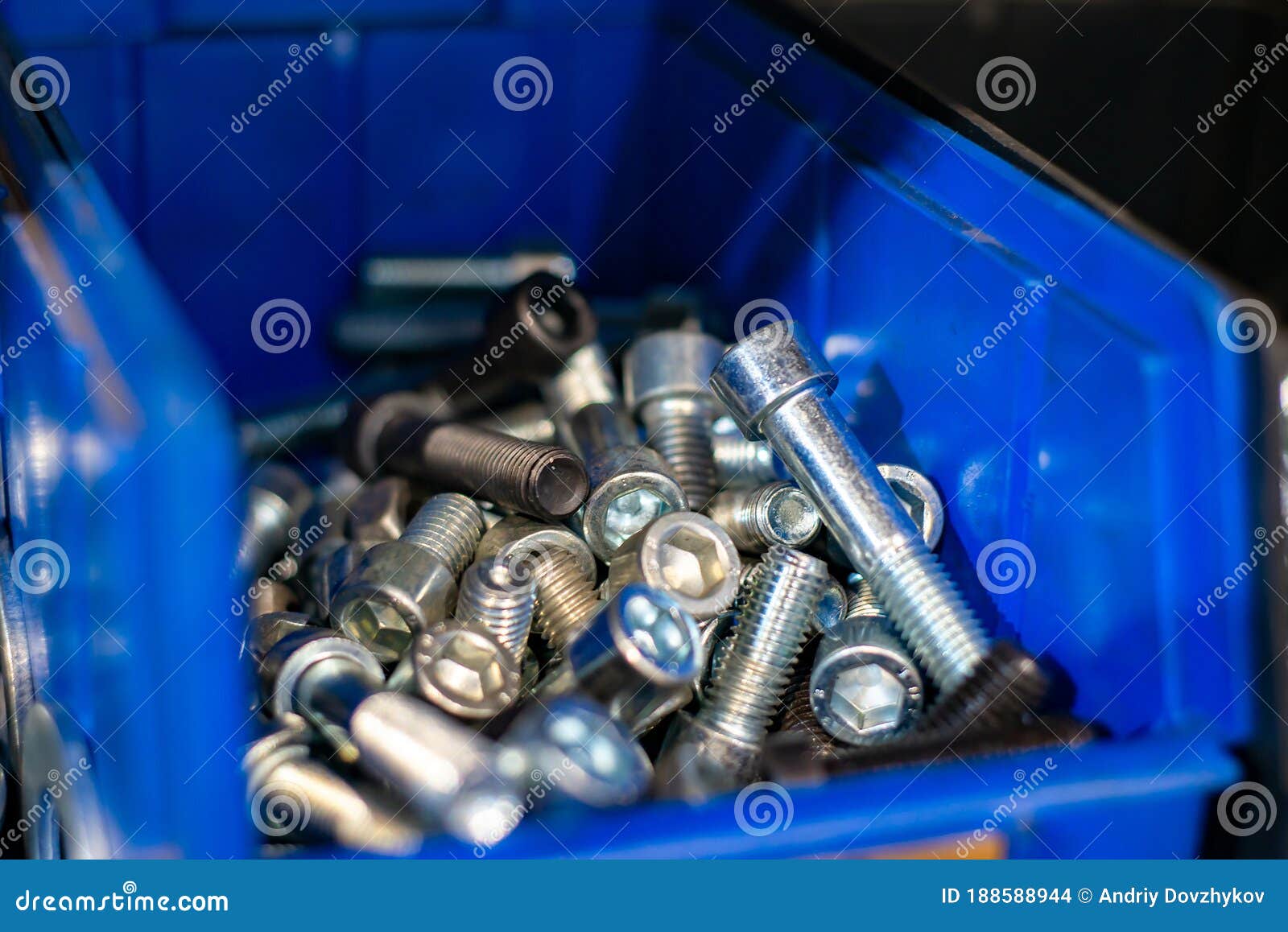 Galvanized Steel Bolts, Screws, Nuts in a Blue Plastic Box on a Rack in ...