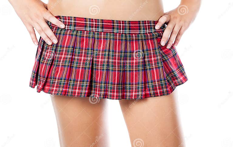 Gambe Sexy Della Ragazza In Minigonna Del Plaid Fotografia Stock