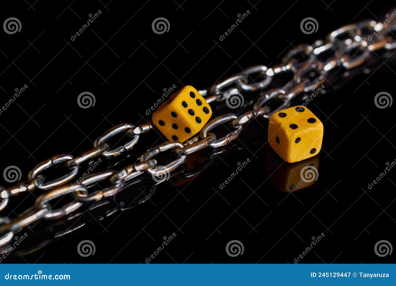 Gambling Addiction. Two Dice and a Chain on a Black Background with ...
