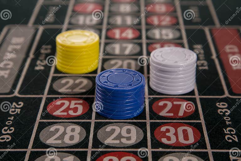 Gambling on a Roulette Table with Different Chips Stock Photo - Image ...