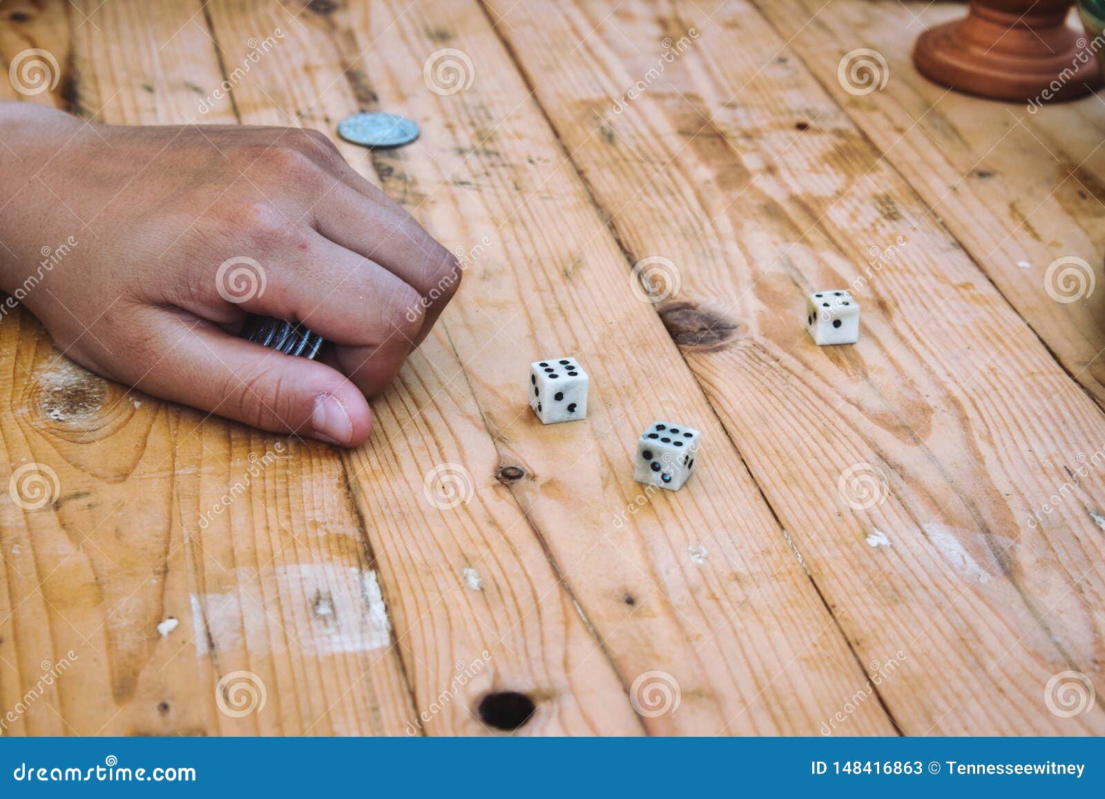 Gambling Whilst Playing a Game with Dice on a Wooden Table Stock Image ...