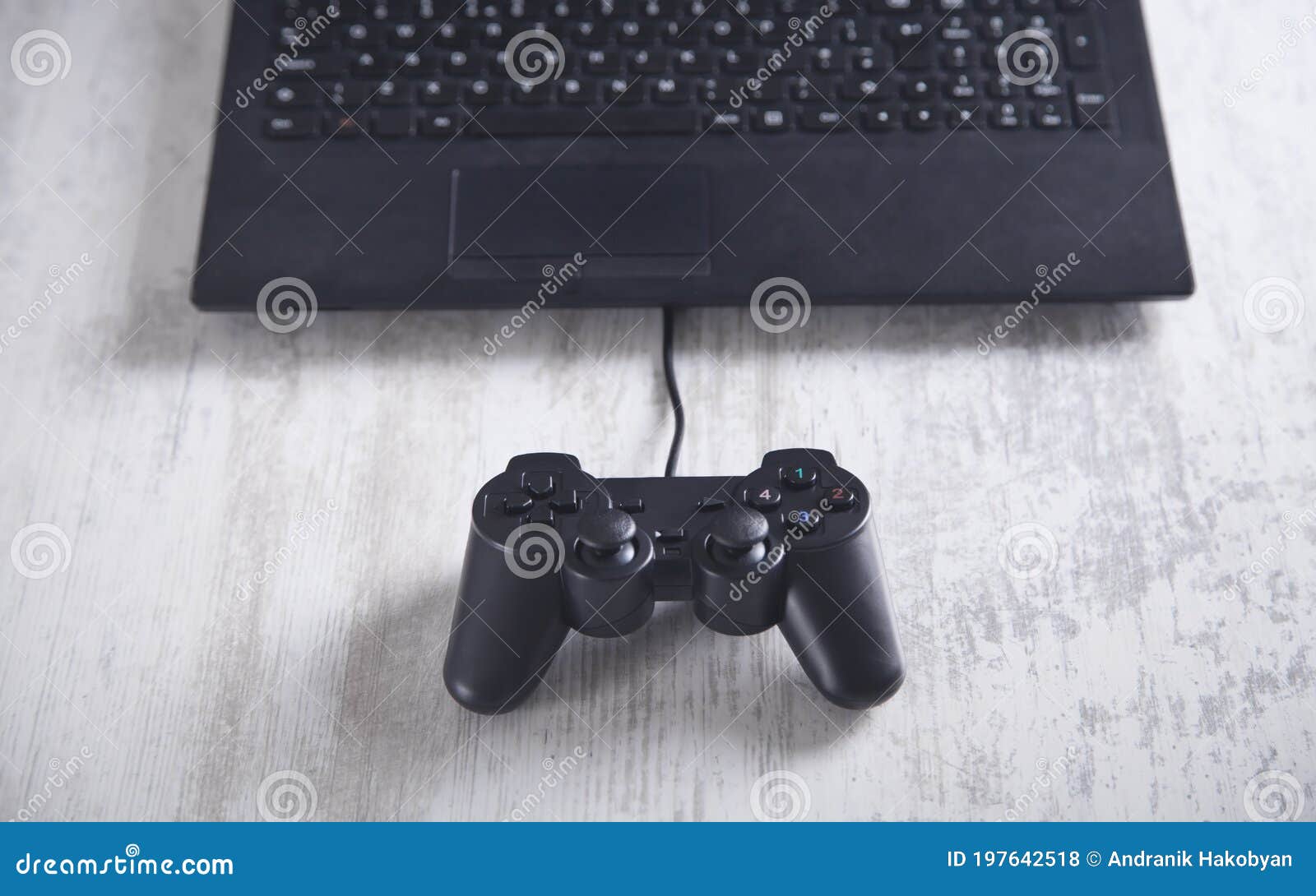 Game Controller and Laptop on White Desk Stock Photo - Image of gamepad ...
