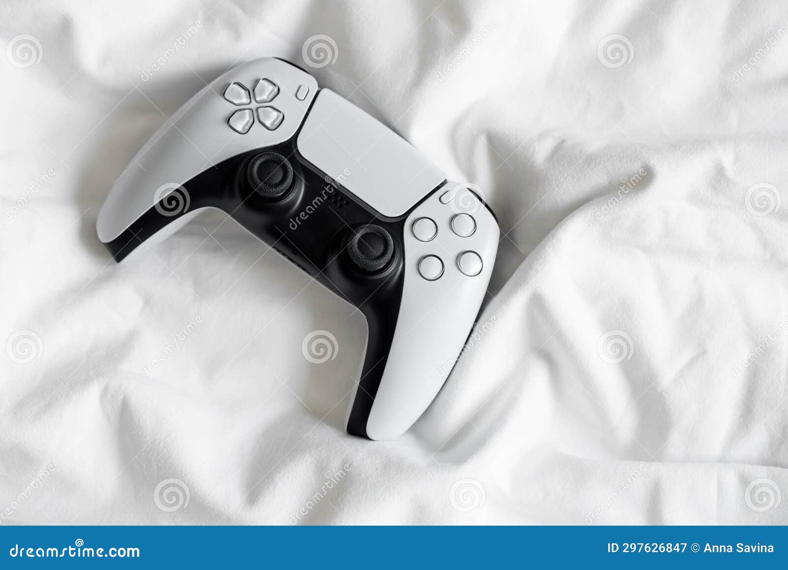 Game Controller, Lying on White Sheets of Bed at Home. Stock Image ...