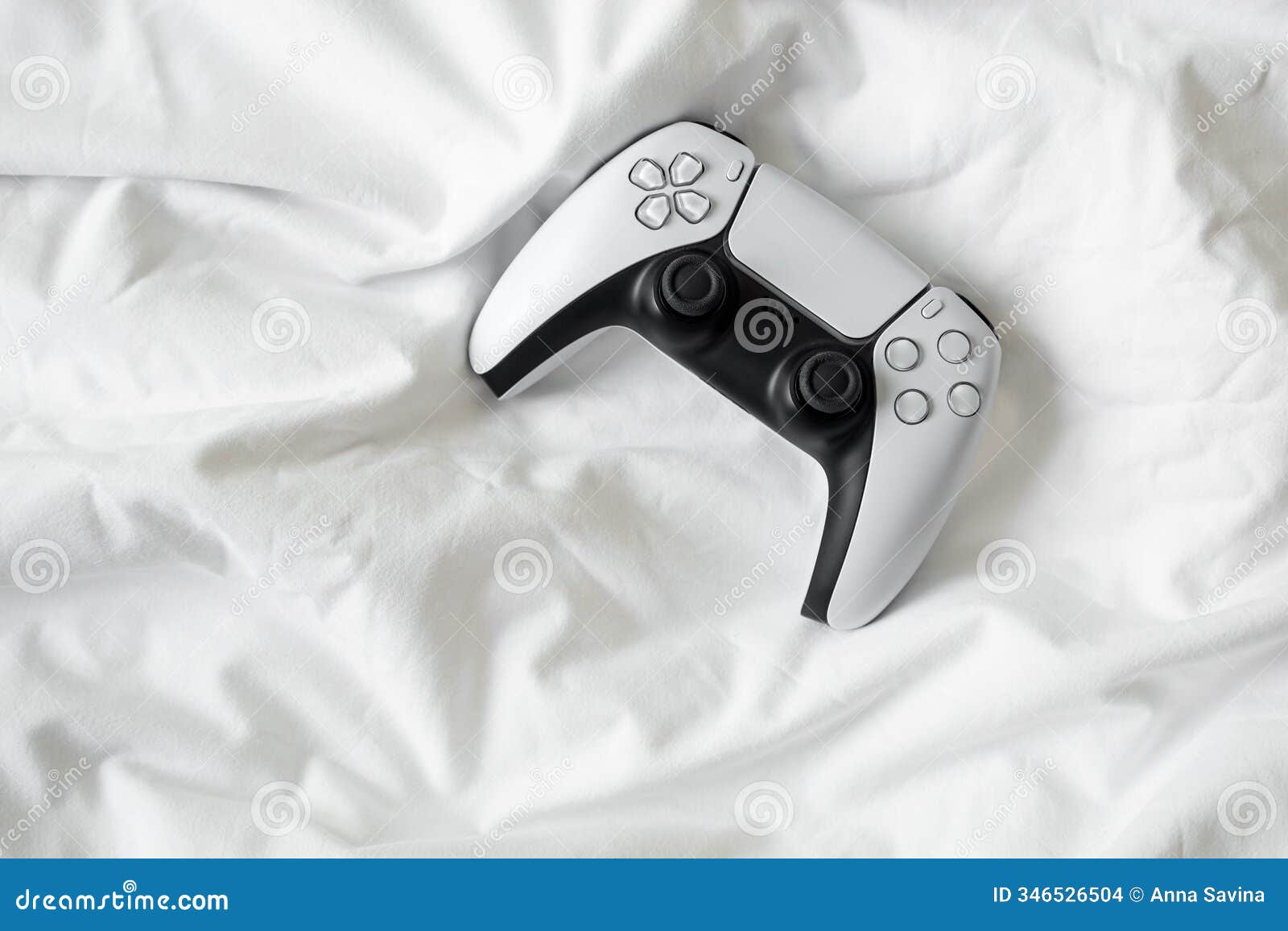 Game Controller, Lying on White Sheets of Bed at Home. Stock Photo ...