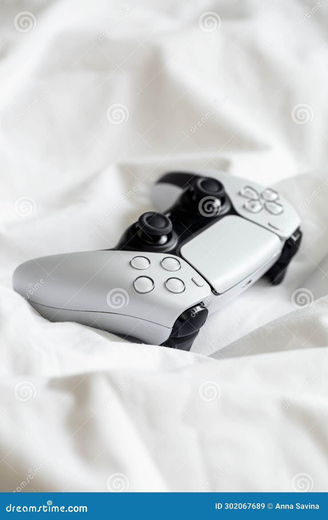 Game Controller, Lying on White Sheets of Bed at Home. Stock Image ...