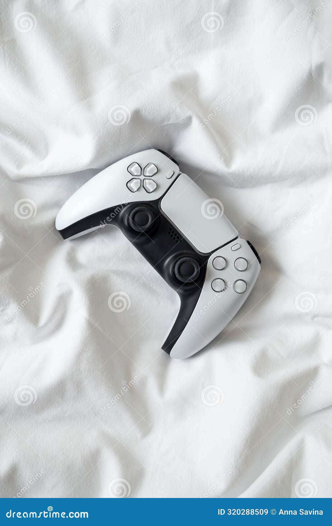 Game Controller, Lying on White Sheets of Bed at Home. Stock Image ...