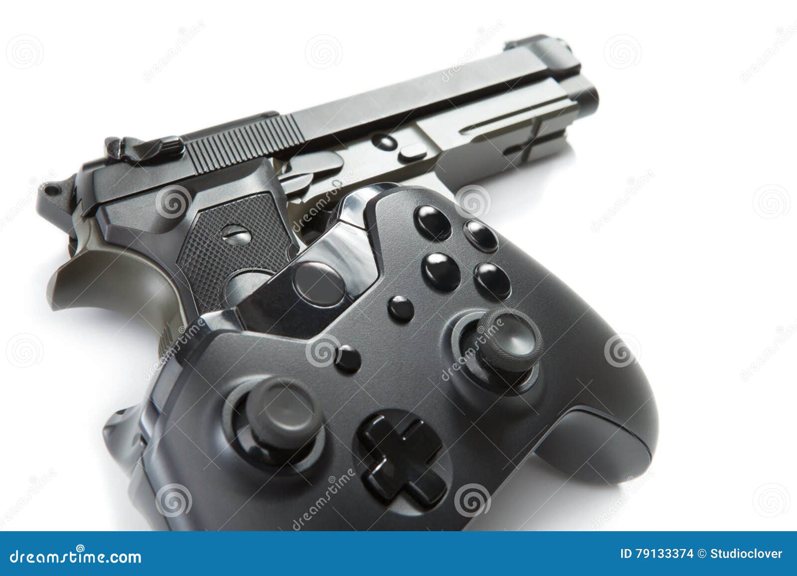 Game Controller Over a Real Handgun - Studio Close Up Shot. Virtual and ...