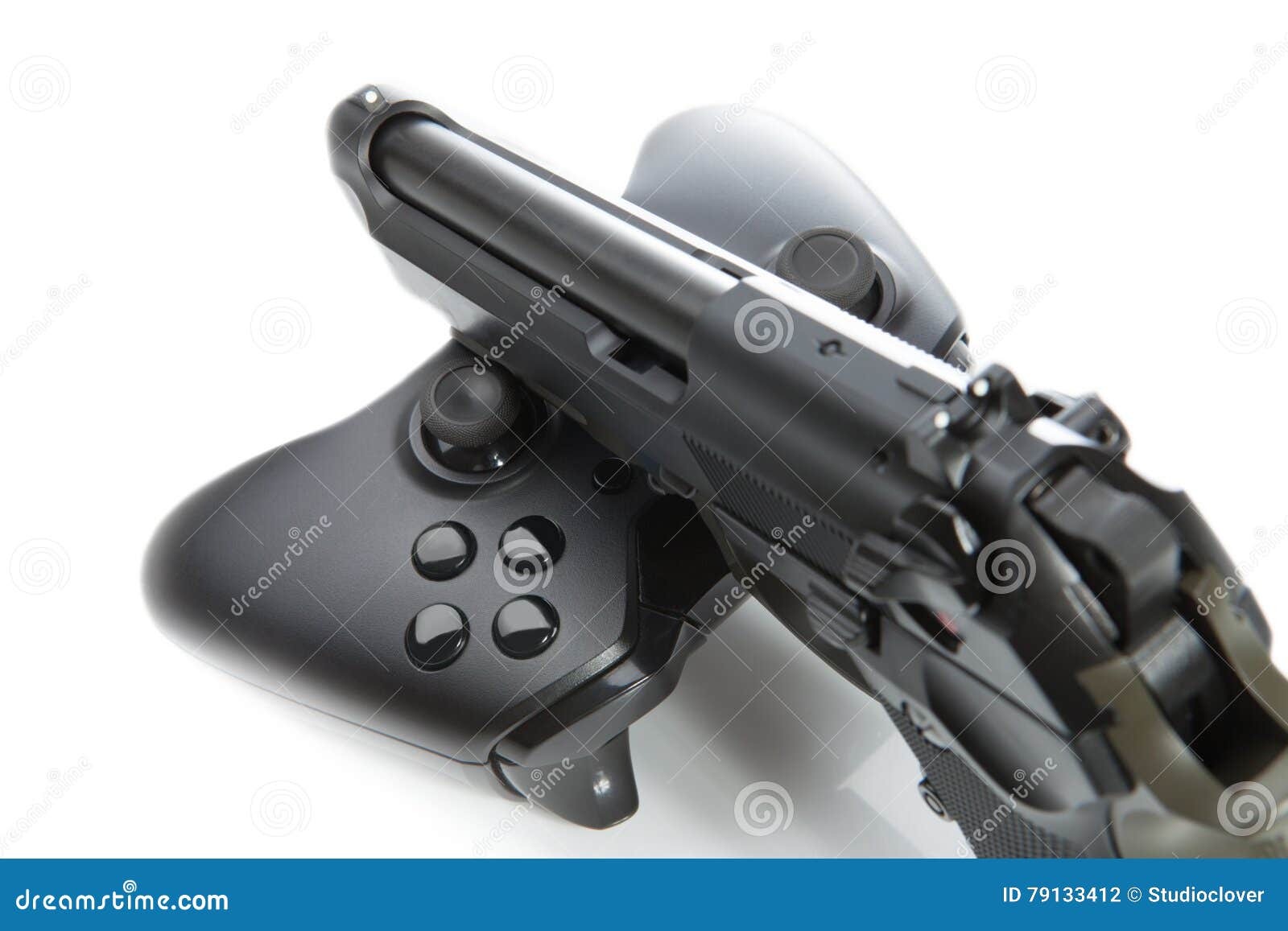 Game Controller and a Real Handgun - Studio Close Up Shot. Virtual and ...