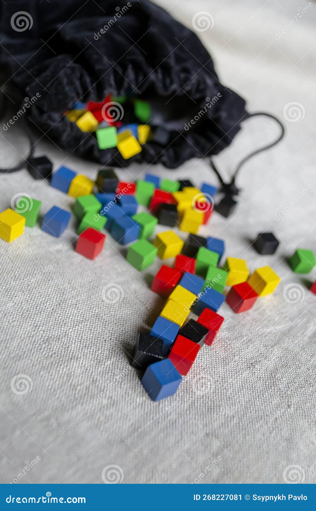 Game Cubes Poured Out of the Black Bag. Lots of Colored Cubes. on the ...