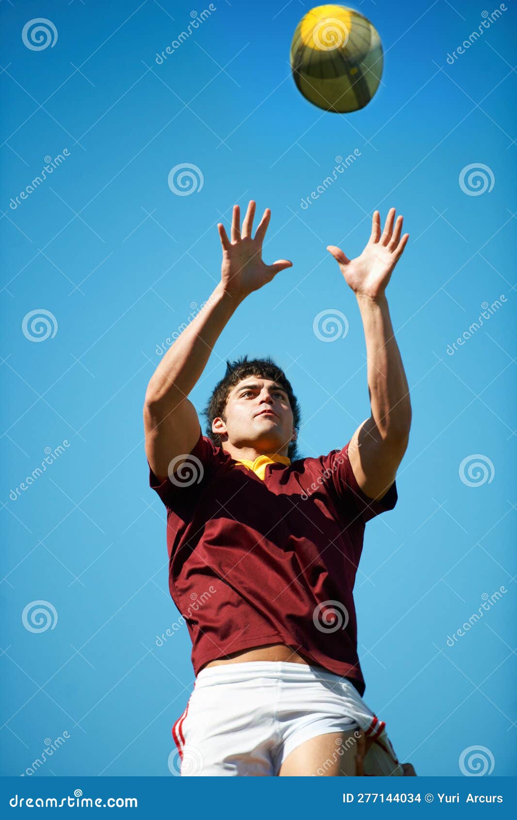 This Game Requires Concentration. a Young Rugby Player Catching the ...