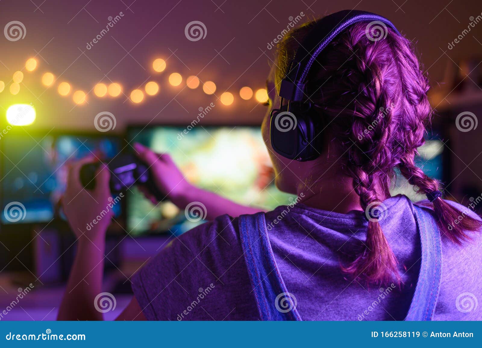 Gamer Girl with a Joystick Plays on a Console or Computer Using a ...