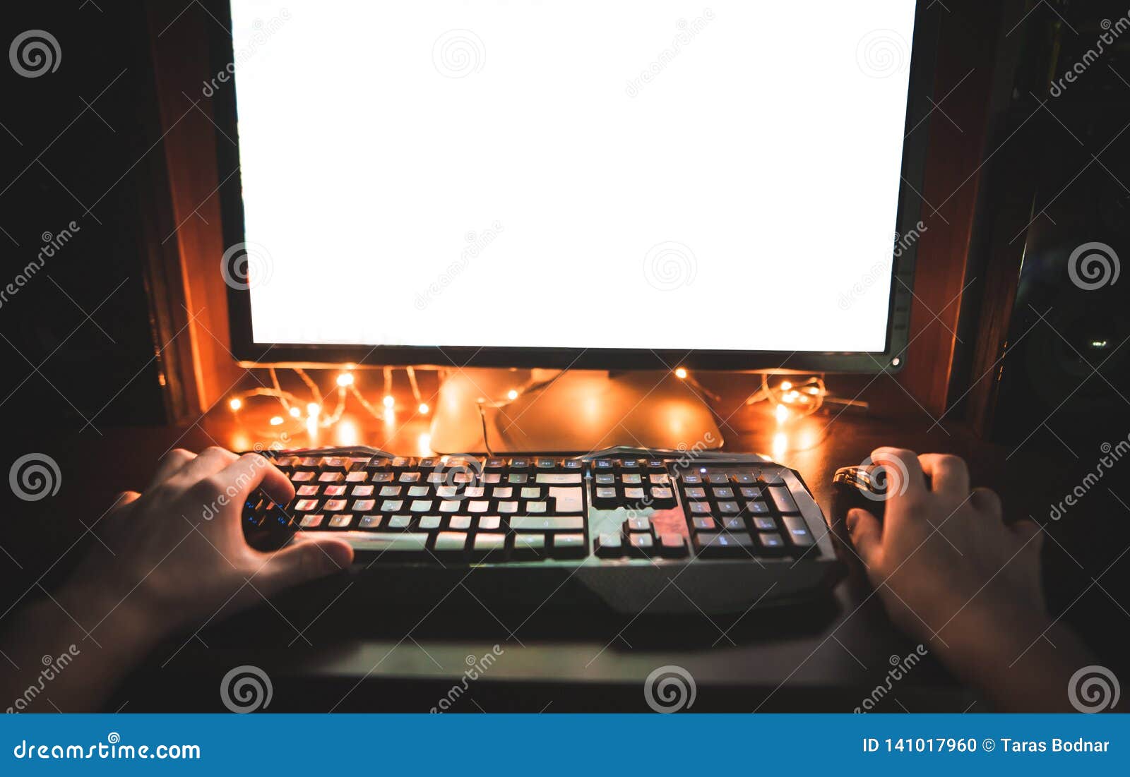 Gamer Plays Video Games at Home on a White Screen Computer. Hands on ...