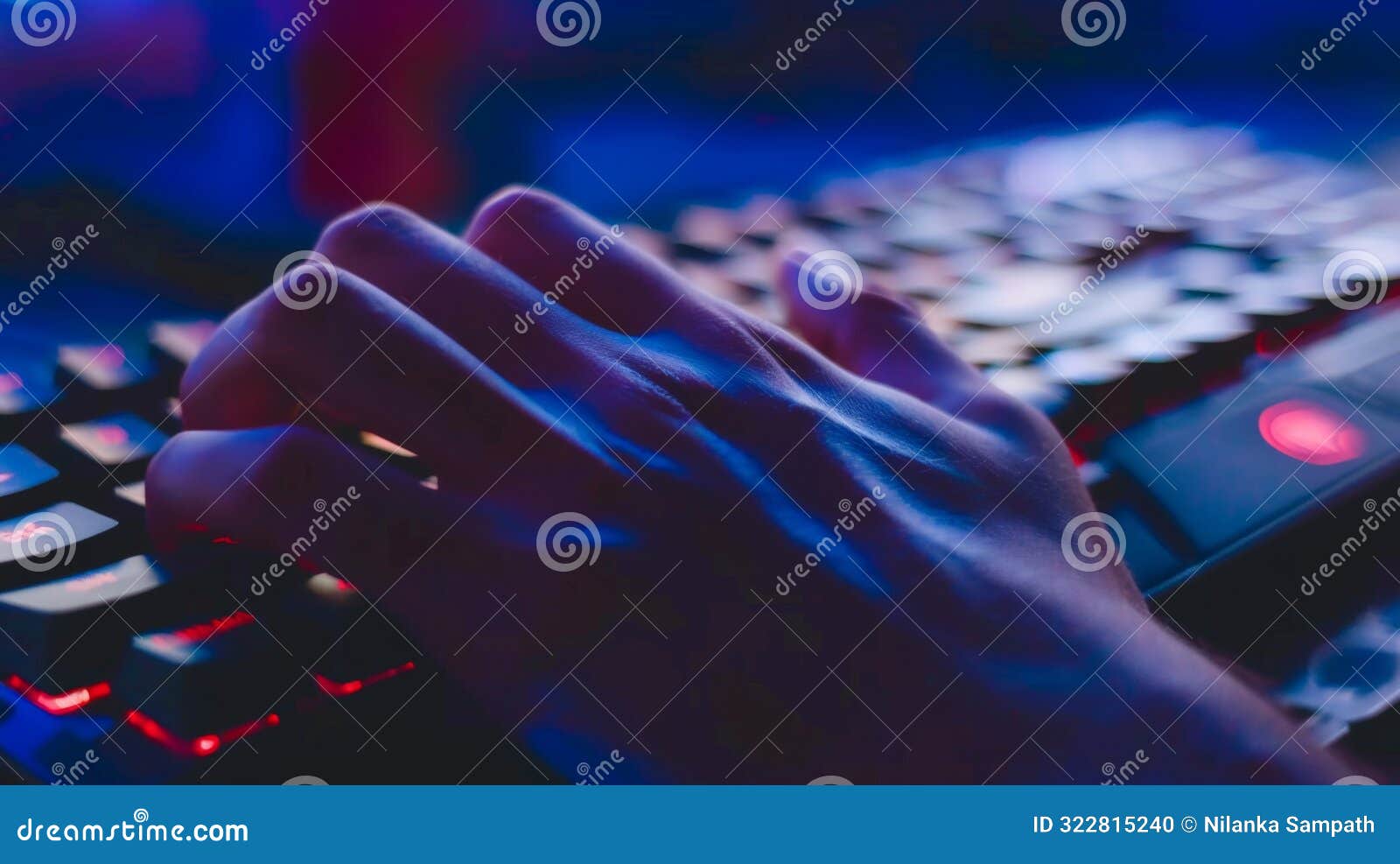 Gamer S Hand Pressing Keys on a Backlit Gaming Keyboard Stock ...