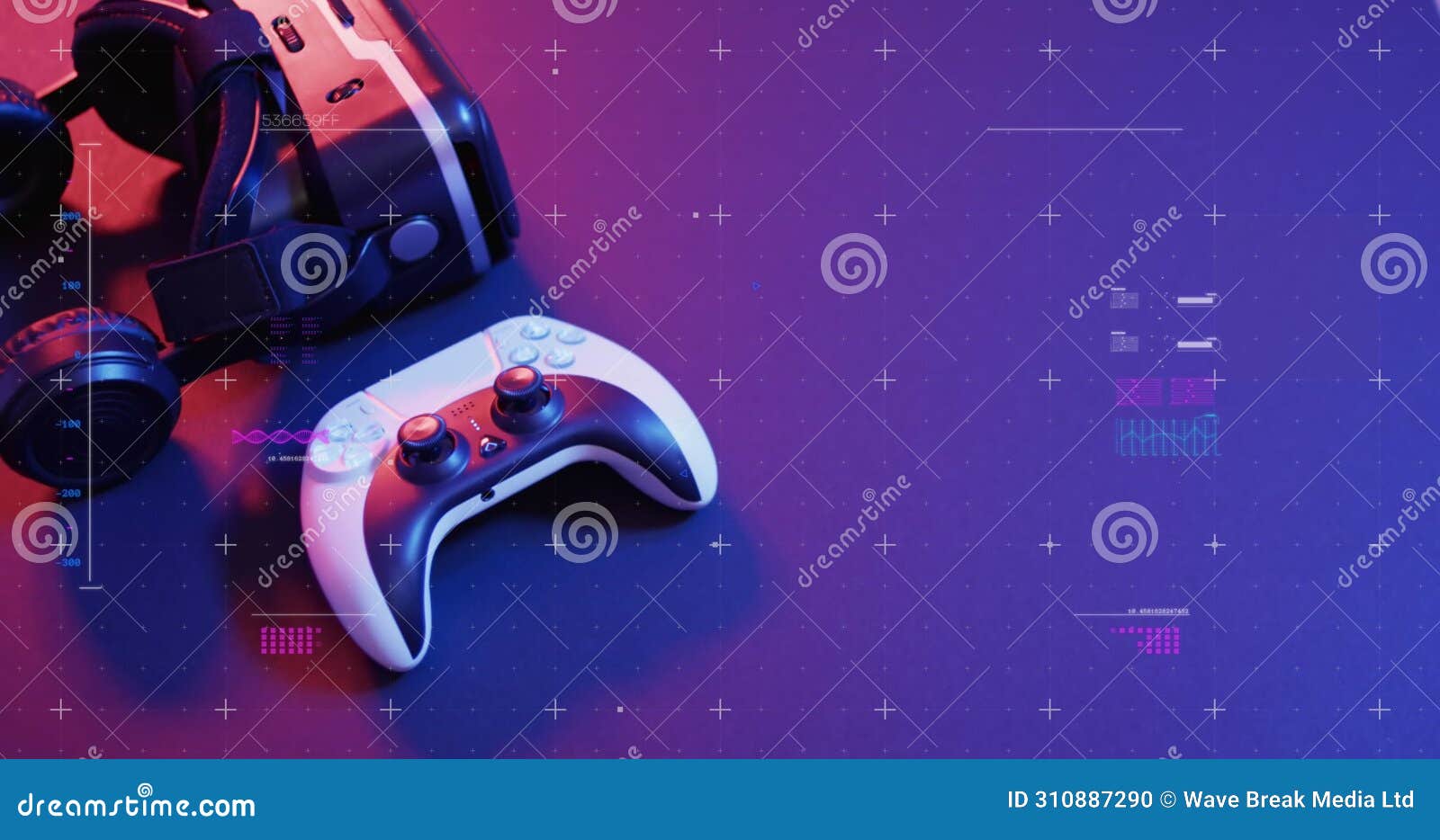 A Gaming Controller and Camera Rest on a Vibrant Surface Stock Photo ...