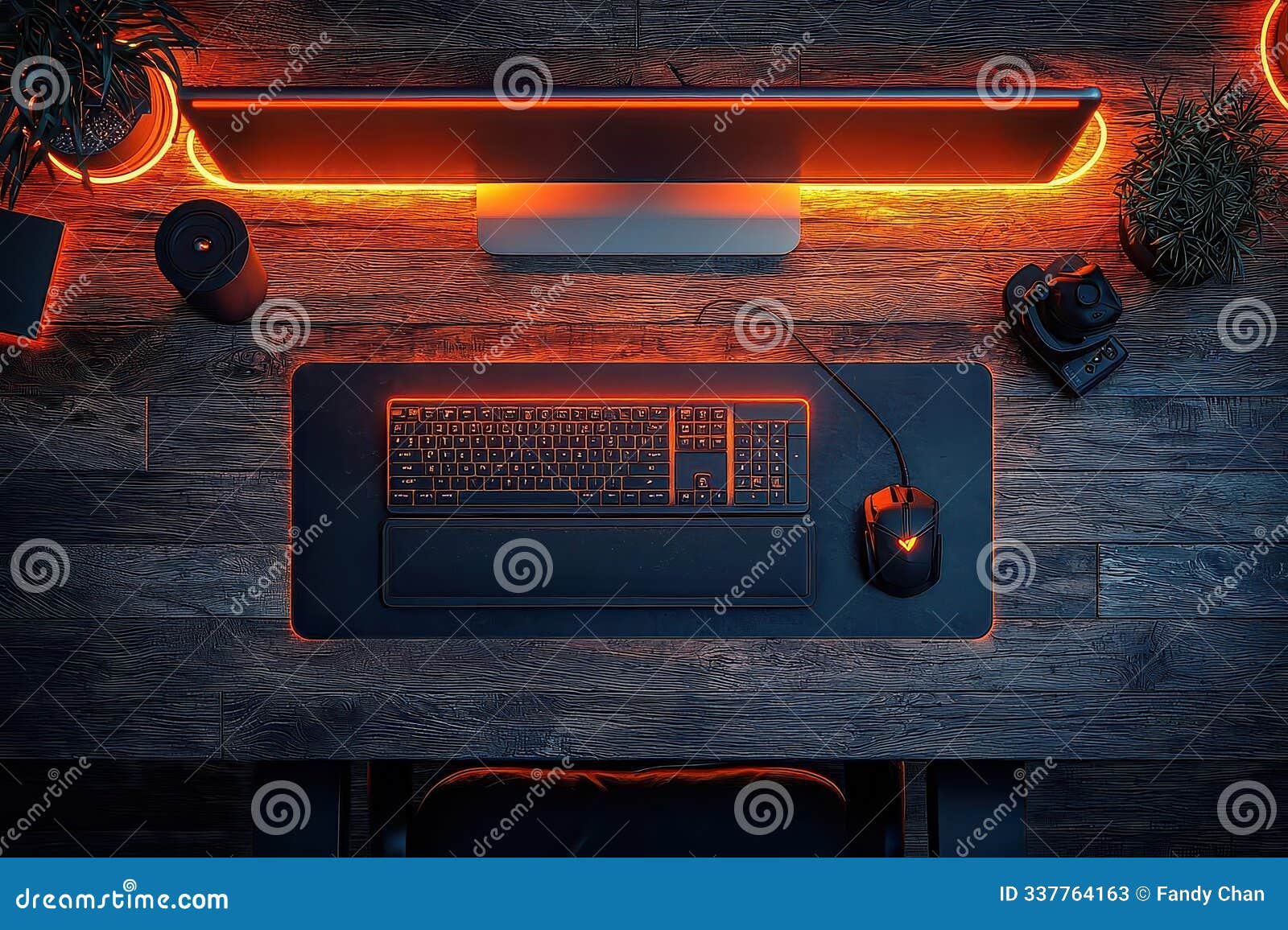 Gaming Setup with Keyboard, Mouse, and Monitor with Orange Backlight ...